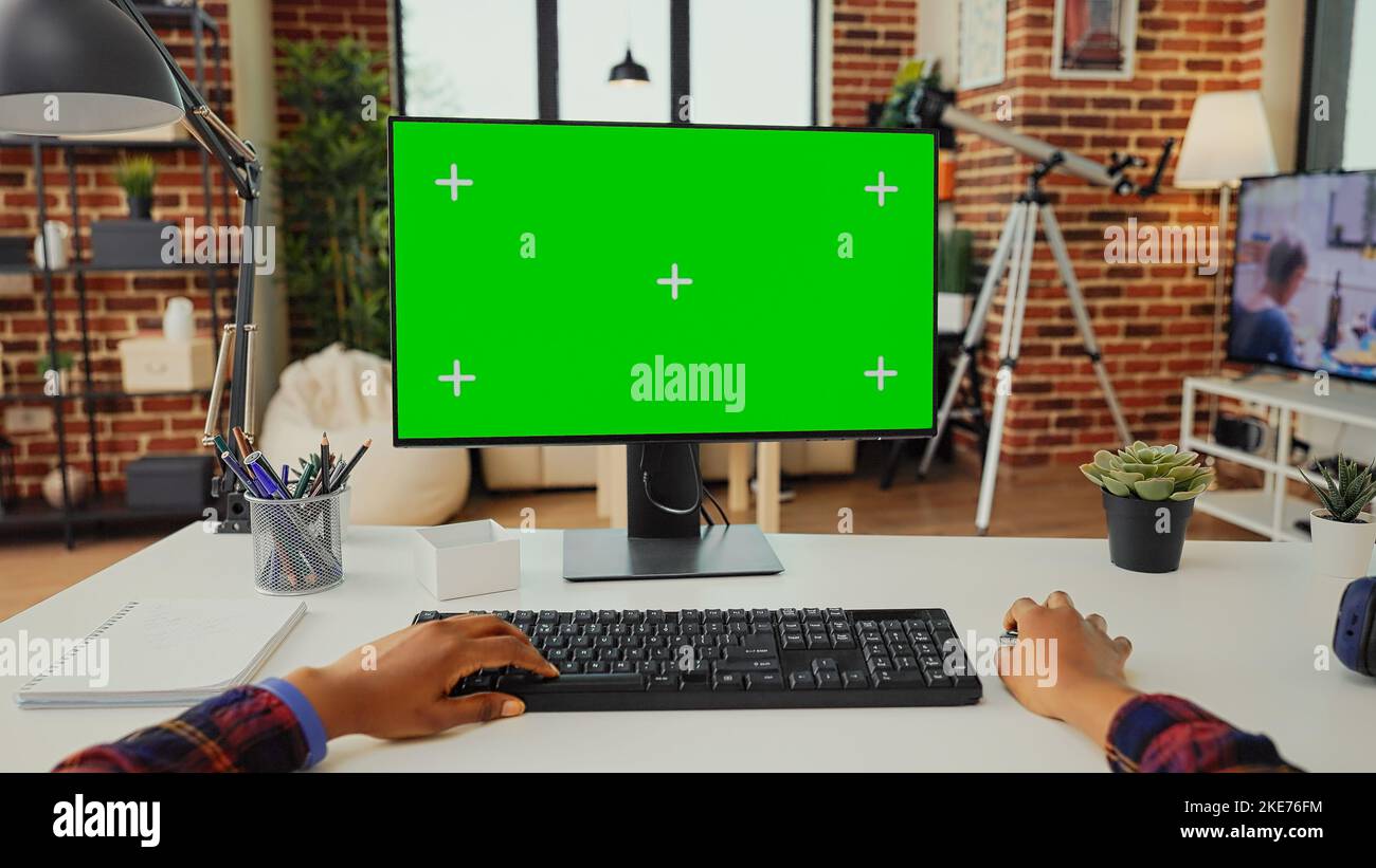 Office worker analyzing isolated greenscreen on computer to work with ...