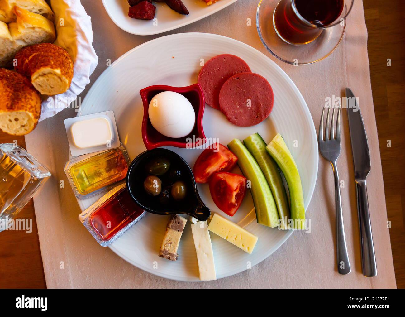 Turkish halal breakfast with cheese, sausages, eggs, vegetables, olives ...