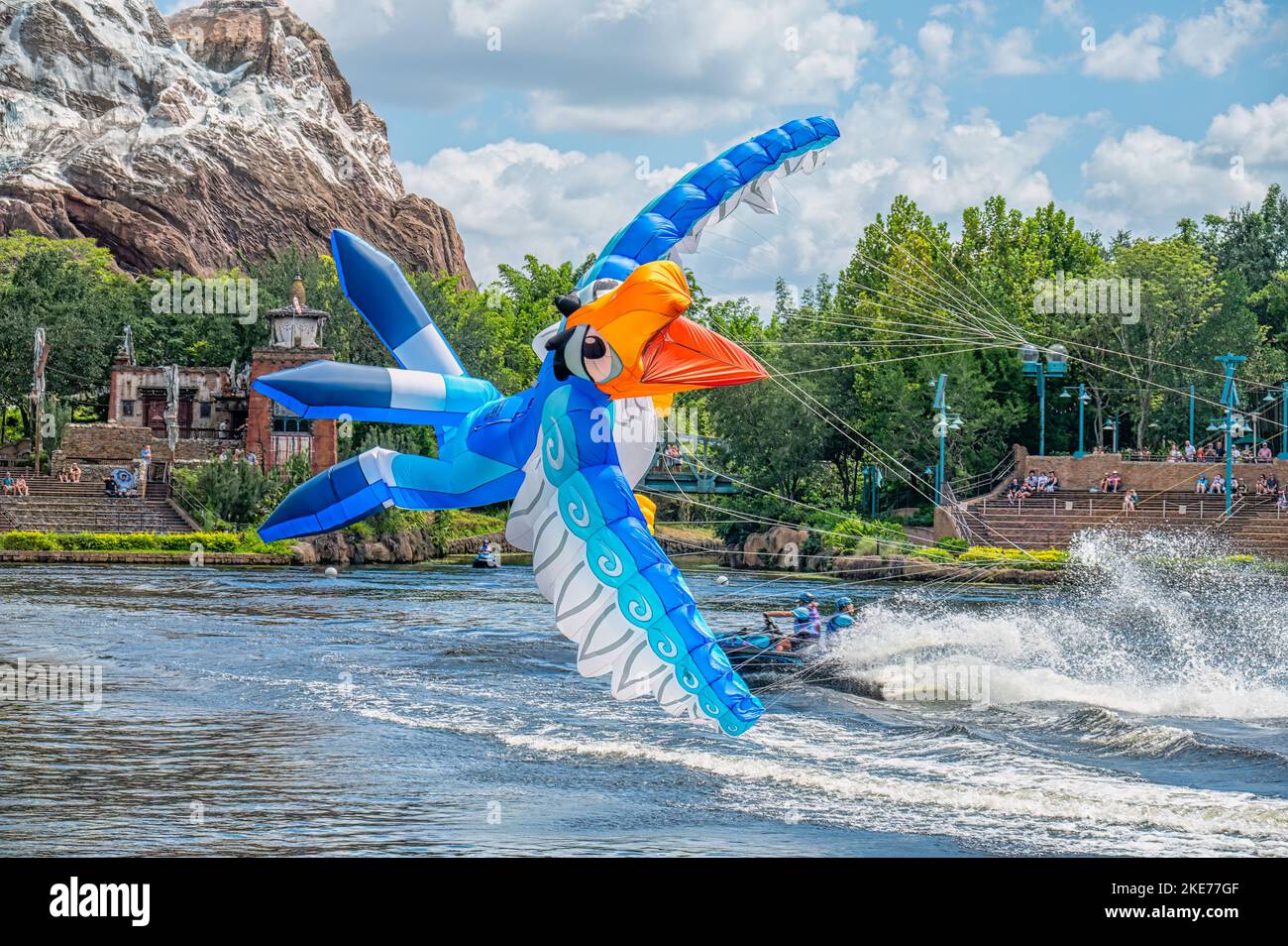 Large parrot shaped Kite flying through the air Stock Photo - Alamy