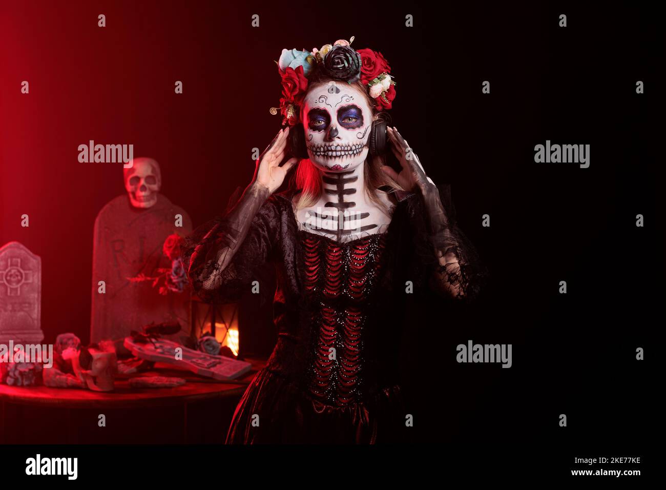 Goddess of death enjoying music on headphones, wearing skull make up ...