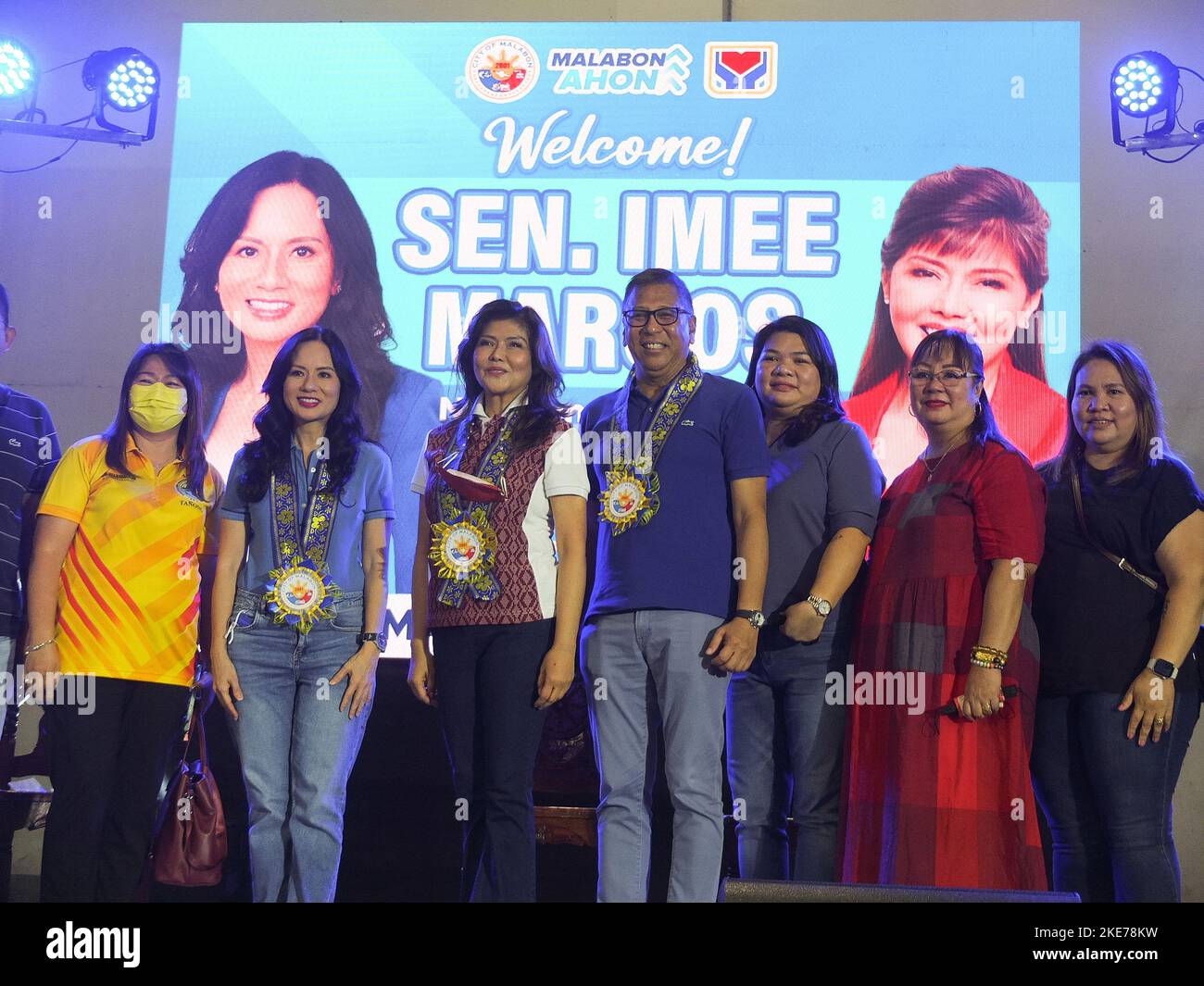 Senator Imee Marcos (3L) poses for a group picture together with ...