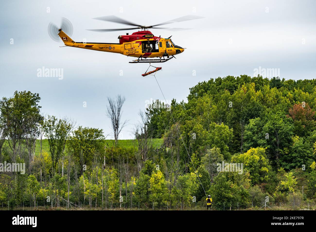 A Royal Canadian Air Force military helicopter hovering during an air ...
