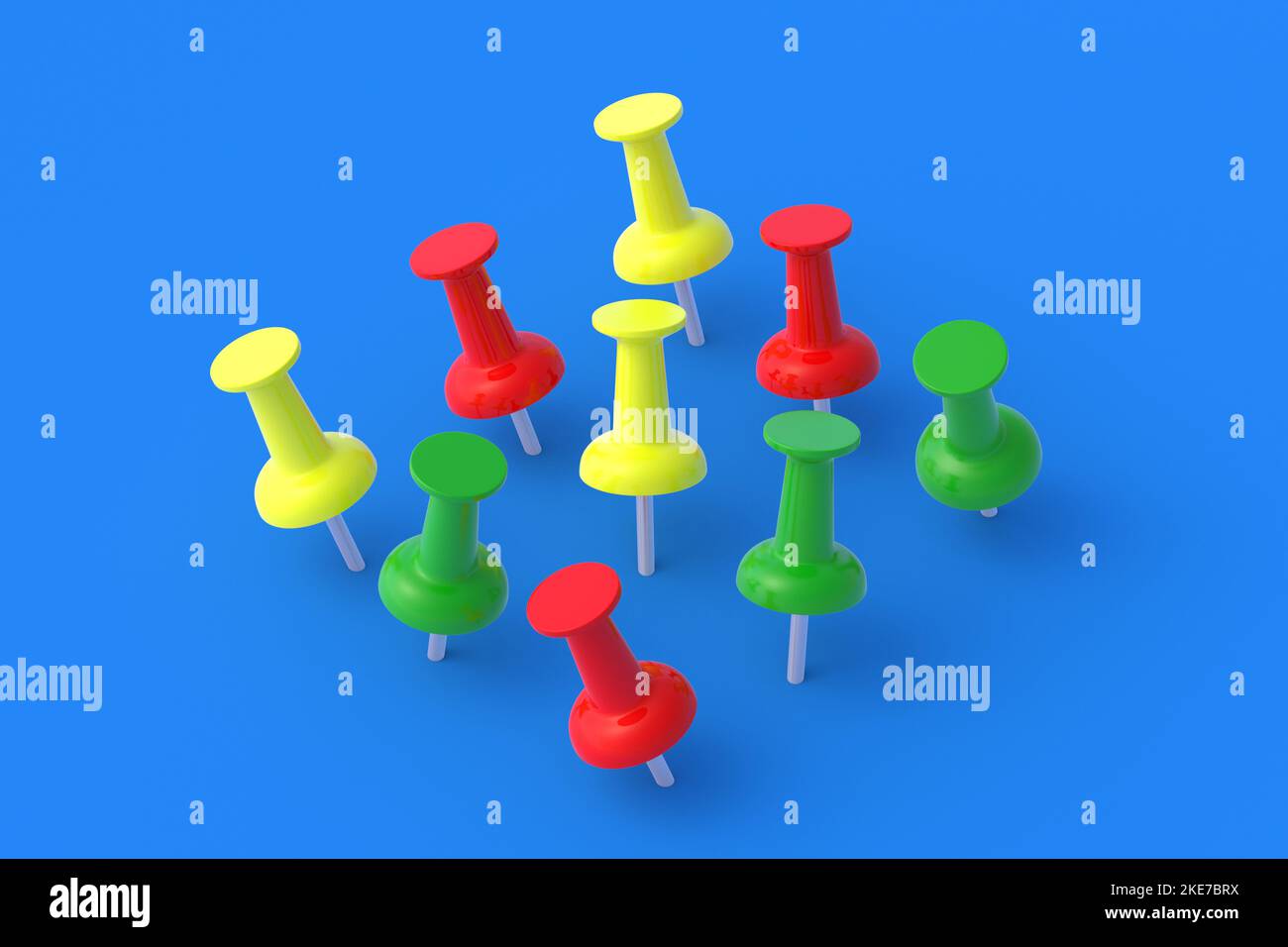 Different color push pins on blue background. Stationery tools. Office ...