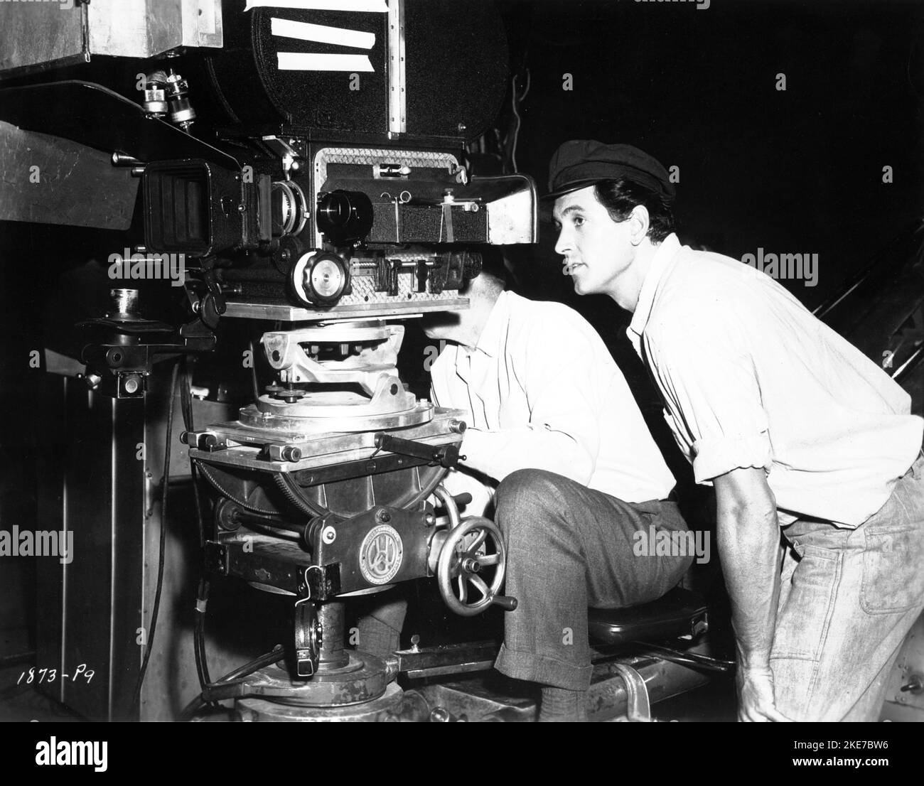 ROCK HUDSON on set candid looking through Movie Camera viewfinder ...