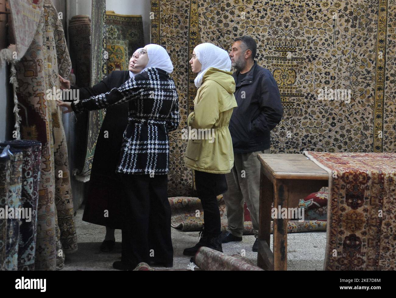 Damascus, Syria. 10th Nov, 2022. People shop for carpets at a workshop ...