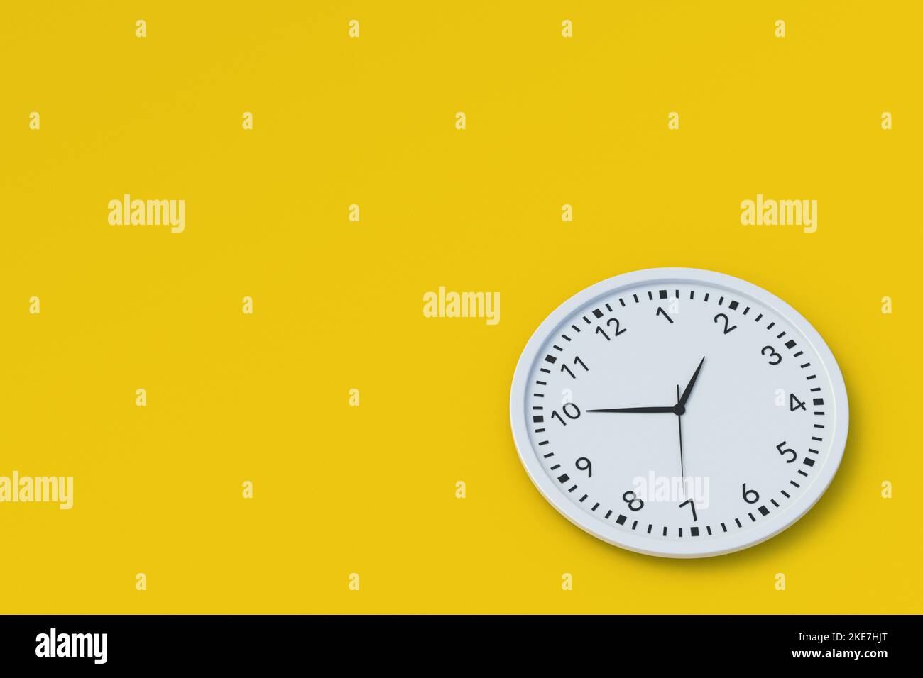 Simple wall clock in corner on yellow background. Home accessories ...