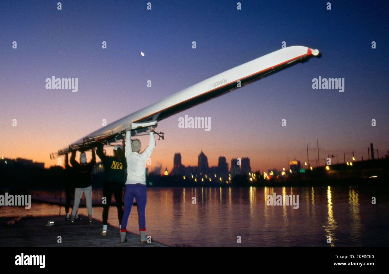 Scullers prepare to put their scull into the Schuylkill River at dawn ...