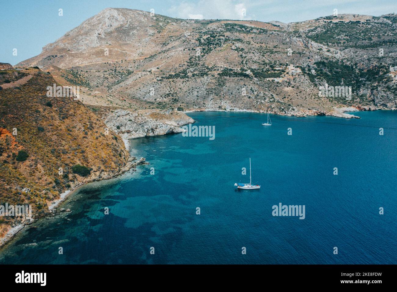 The scenic sea mountains and blue water with sailing boats in Porto ...