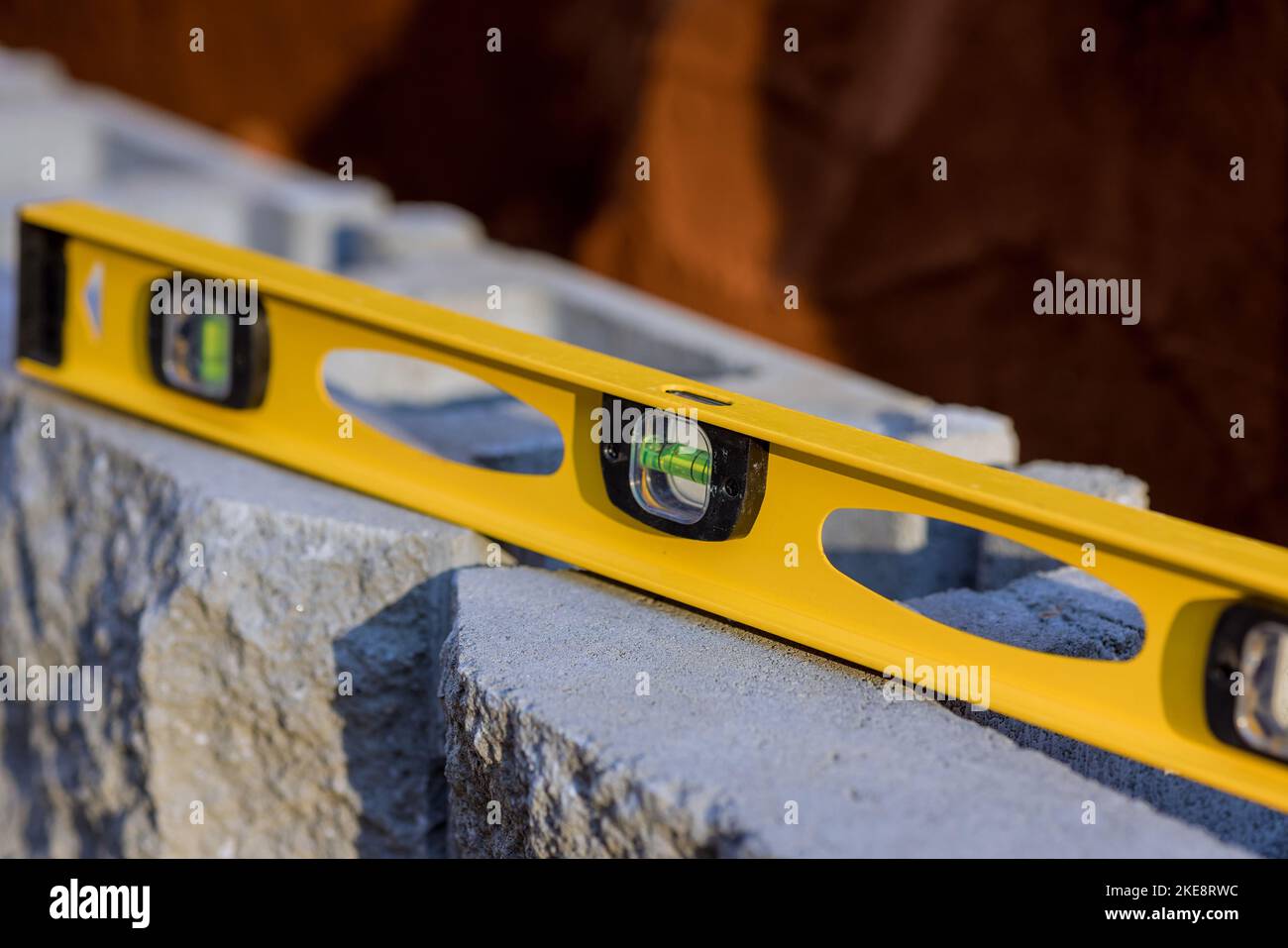 During construction of retaining wall on new property is leveling tool ...