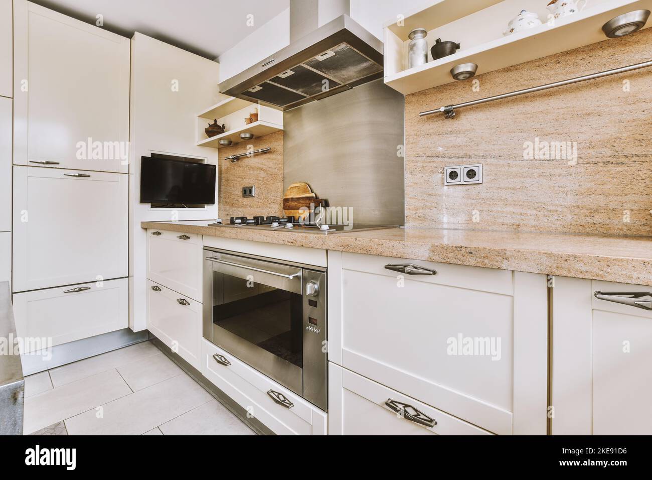 Fragment of interior of light narrow home kitchen with minimalist style ...