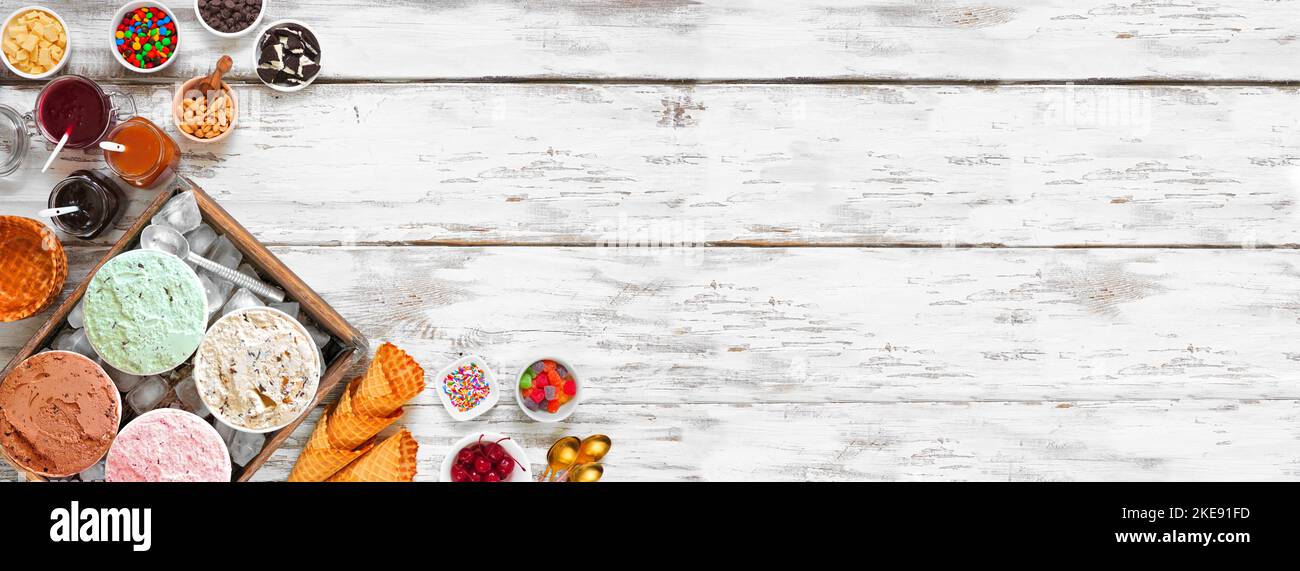 Summer ice cream bar with assorted ice cream flavors and tasty toppings ...