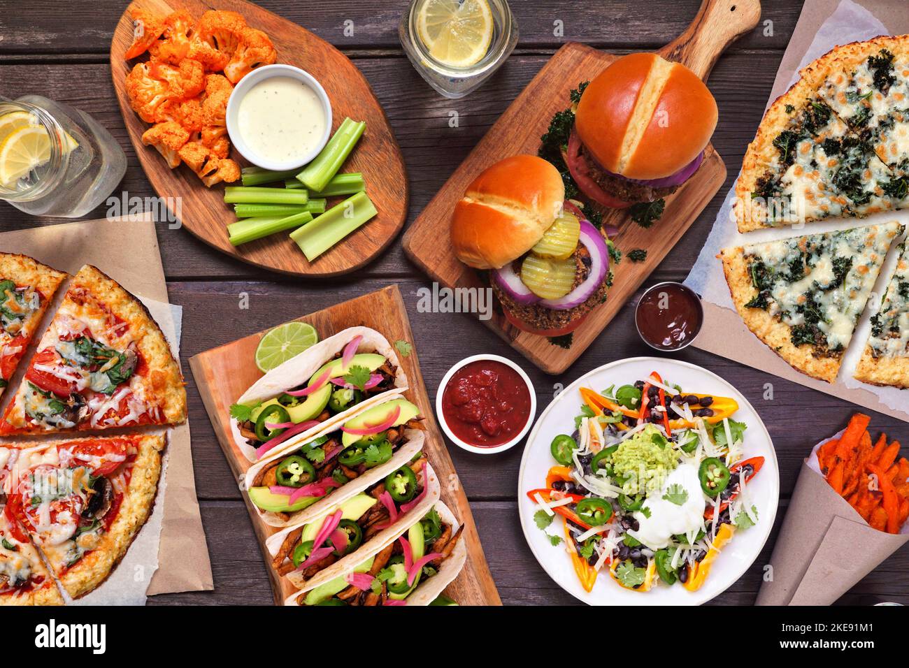 Healthy plant based fast food table scene. Overhead view on a wood ...