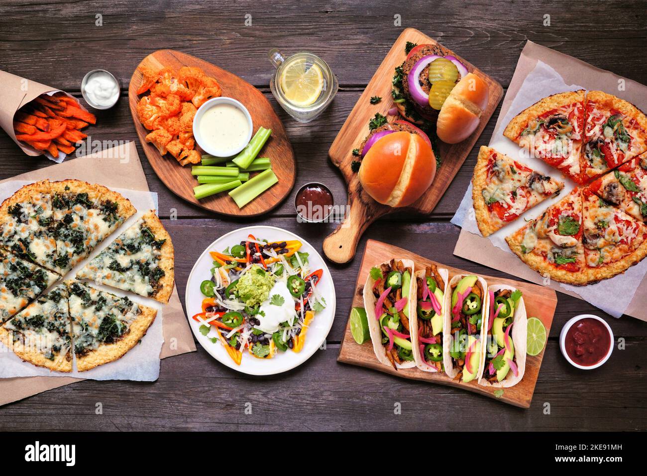Healthy plant based fast food table scene. Top down view on a wood ...