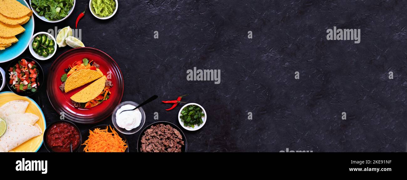 Taco bar corner border with an assortment of ingredients. Top view on a ...
