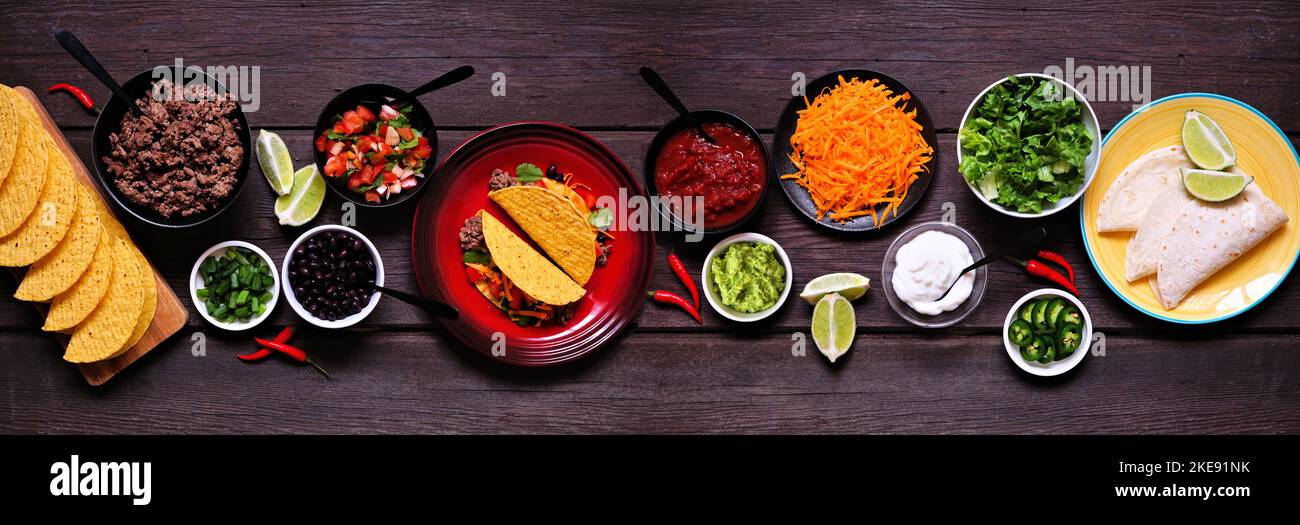Taco bar table scene with a selection of ingredients. Overhead view on ...