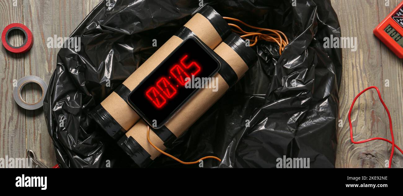 Bomb and tools on wooden background Stock Photo - Alamy