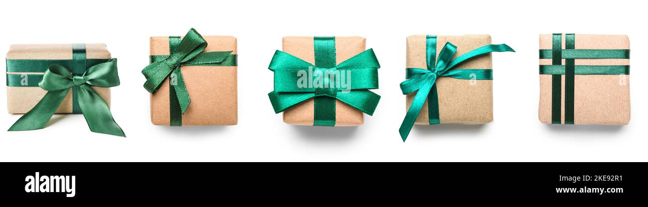 Set of gift boxes with green ribbons isolated on white Stock Photo - Alamy