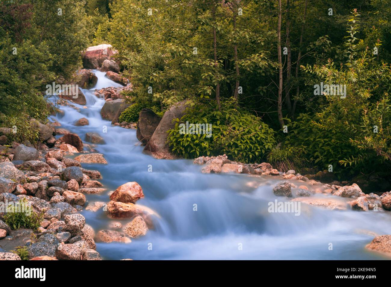 Waterfall in the mountains. A small mountain stream in Kinnor valley ...