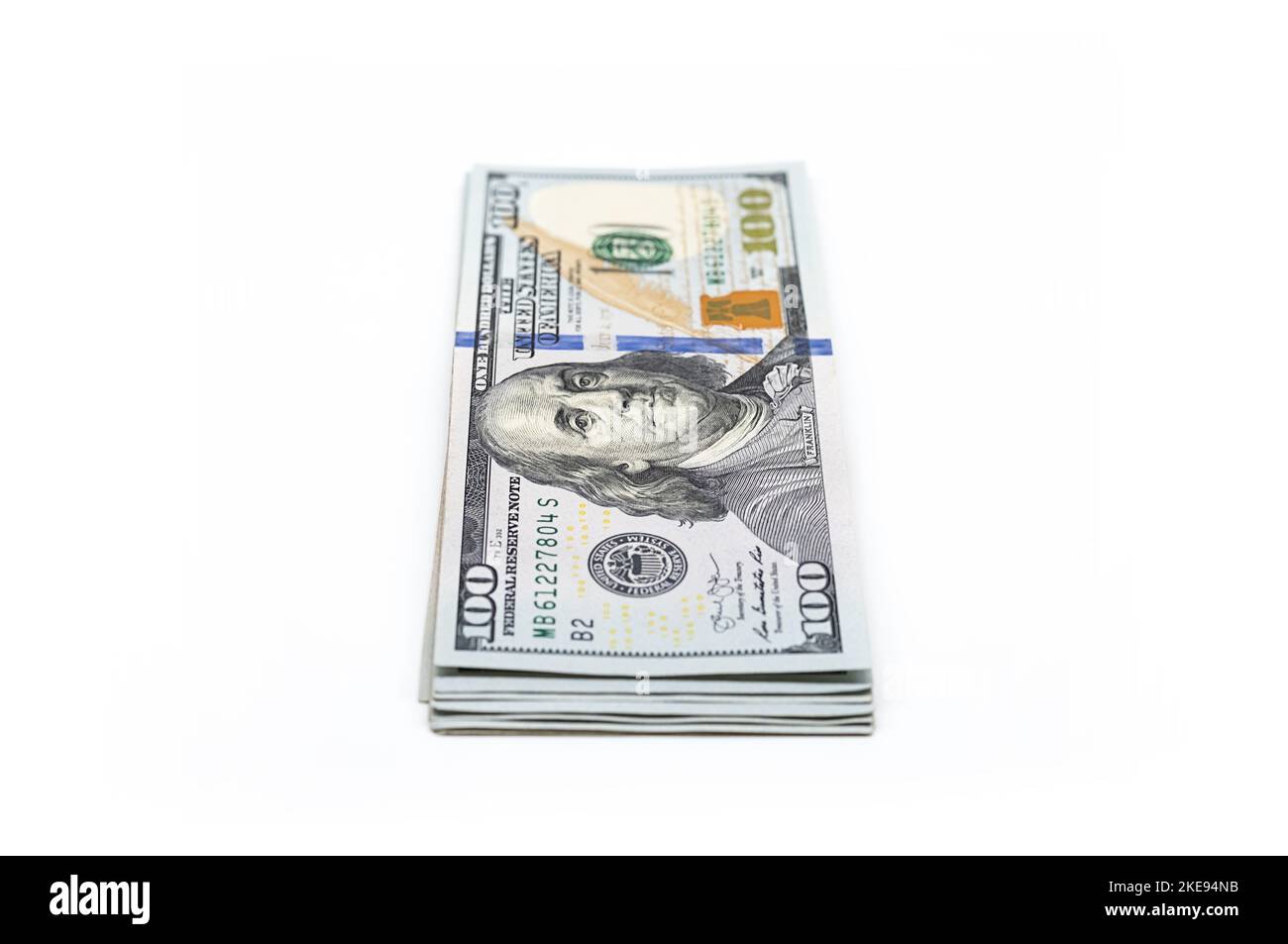 Some one hundred dollar bills. Stack of American cash on white Stock ...