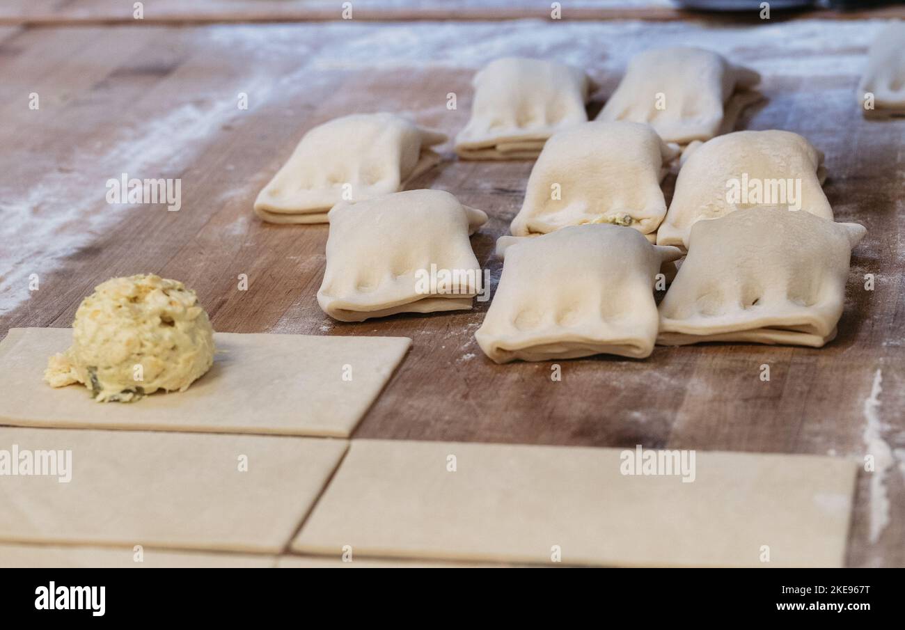 the art of making turnovers in a bakery Stock Photo - Alamy