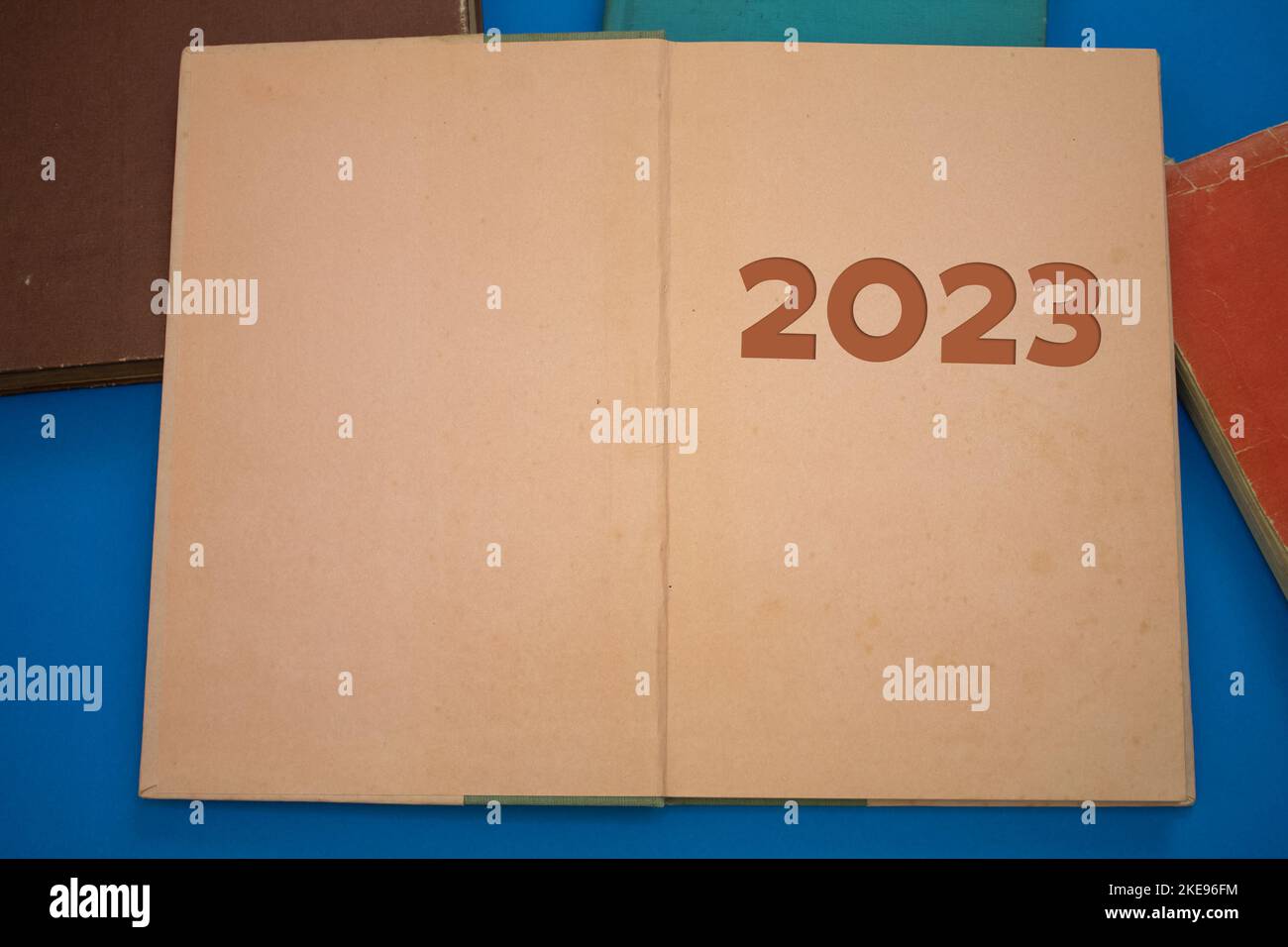 The number 2023 in opened book with vintage, natural patterns old ...