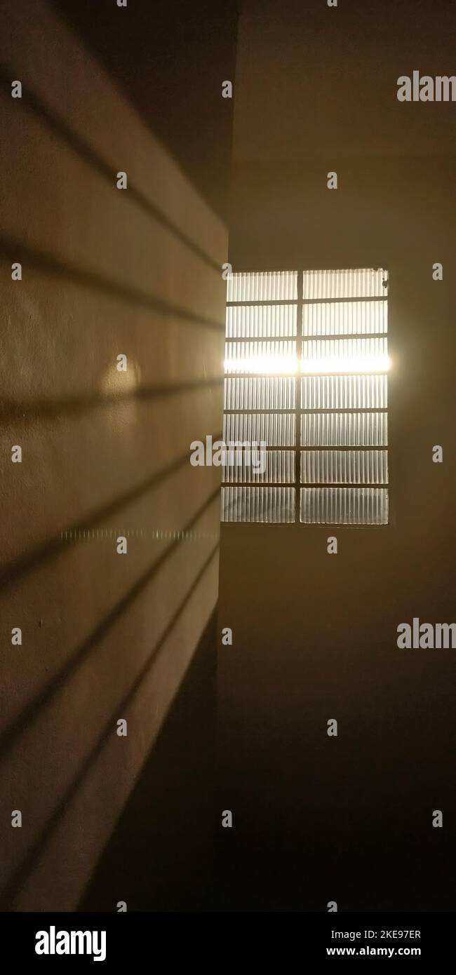 A window reflecting the light in a room Stock Photo - Alamy