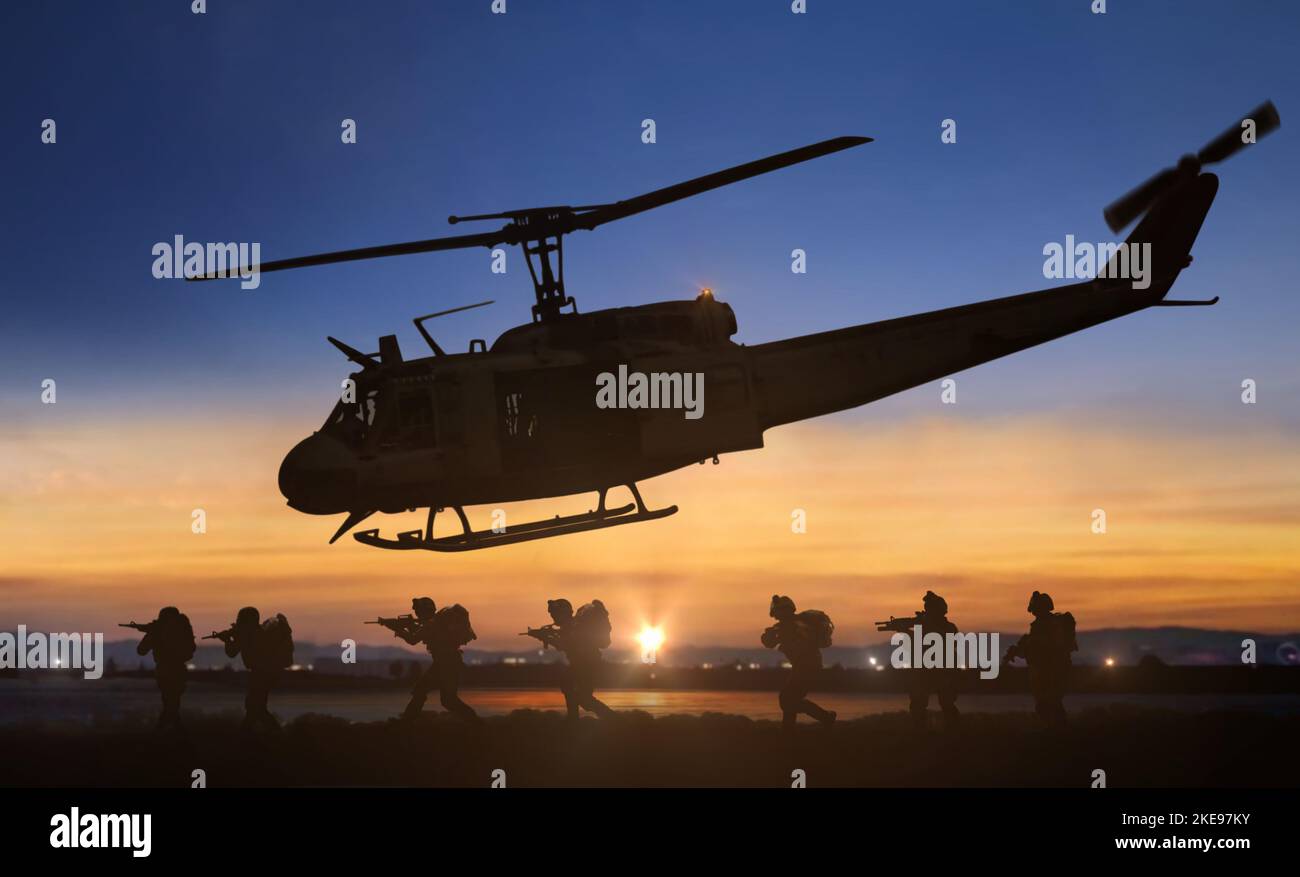 Military special forces helicopter drops operation at sunset Stock ...