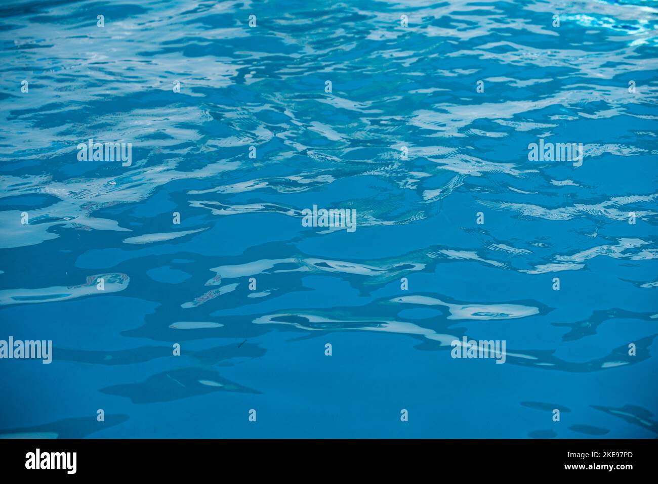 Blue ripped water in swimming pool, water pool texture and surface ...