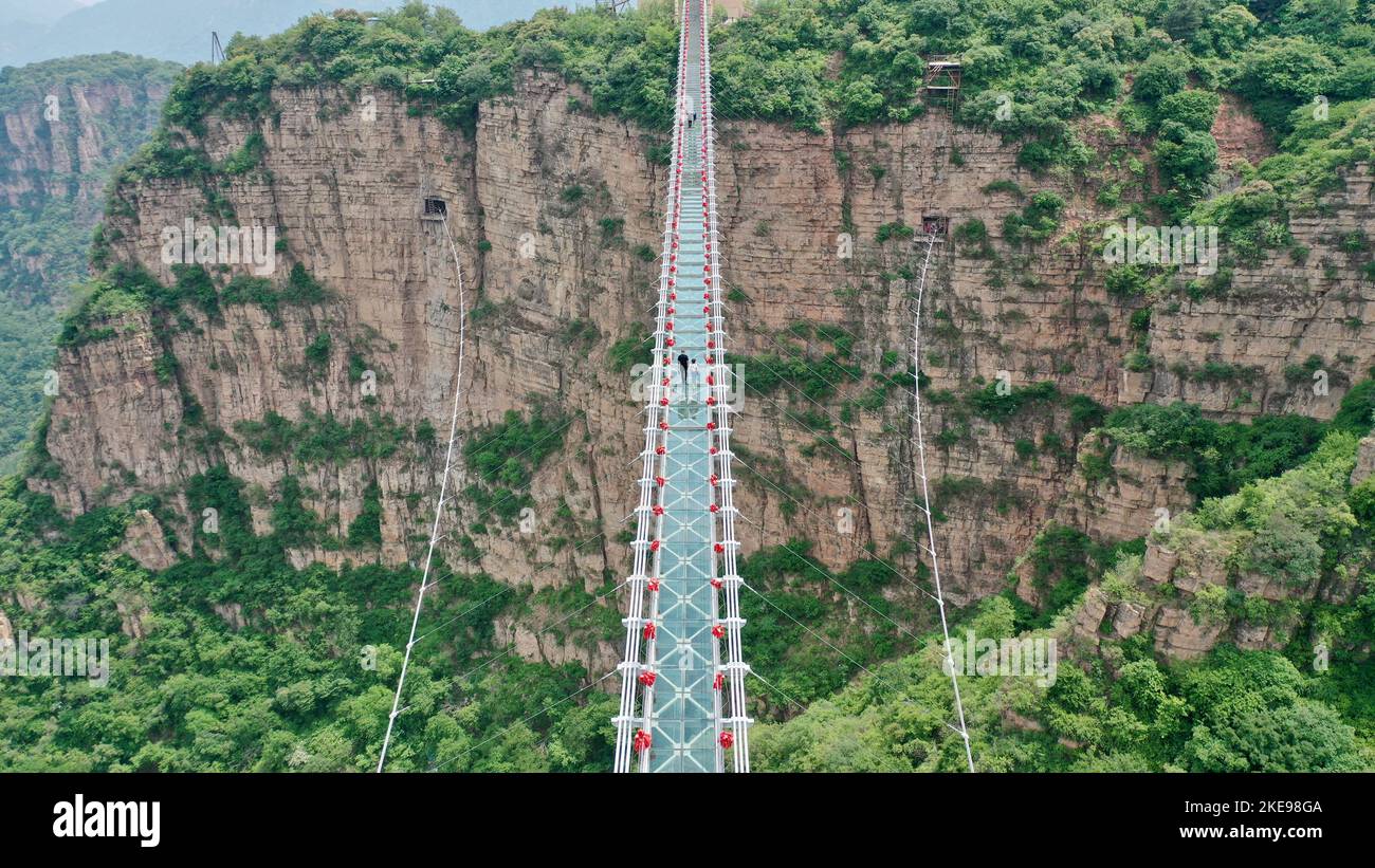 Aerial photos show the world's longest glass suspension bridge ...