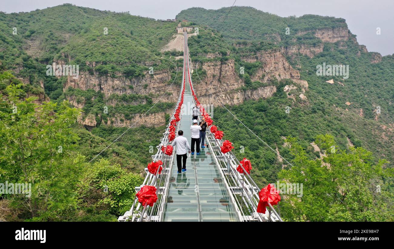 Aerial photos show the world's longest glass suspension bridge ...