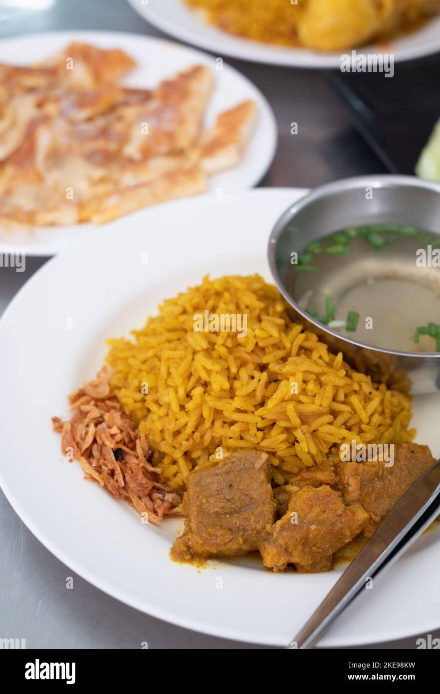 muslim yellow rice with beef and roti background,halal food in sothern ...