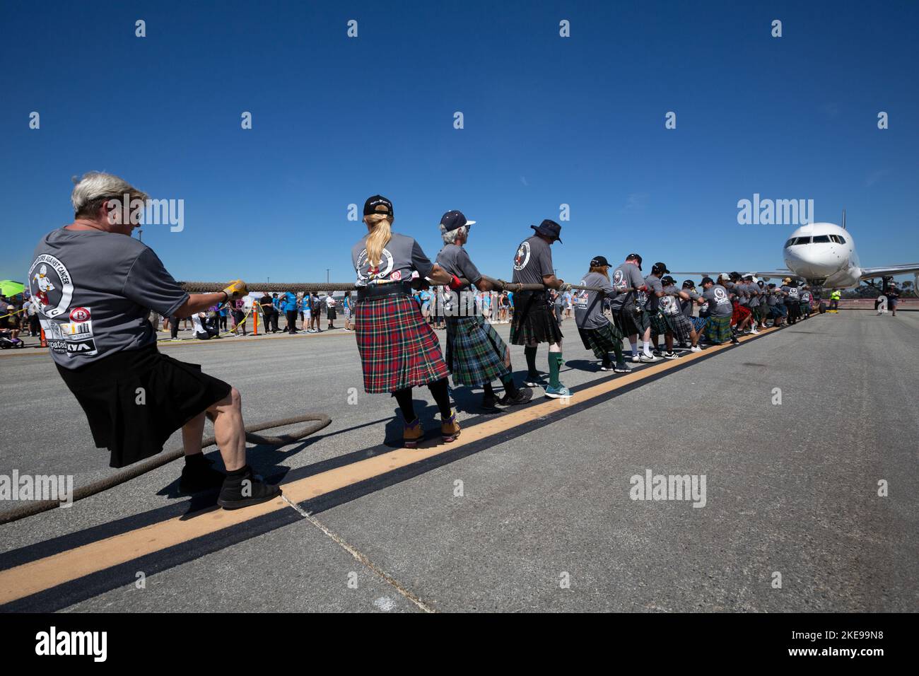 The Kilted Warriors Against Cancer team pulling a UPS plane at the ...