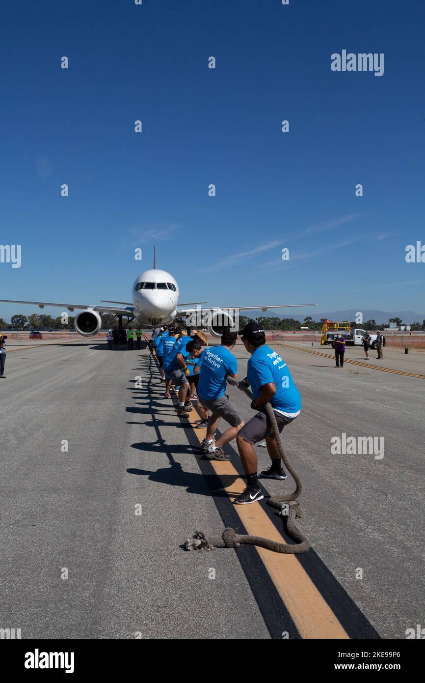 The Kaiser Permanente Team pulling a UPS airplane at the Special ...