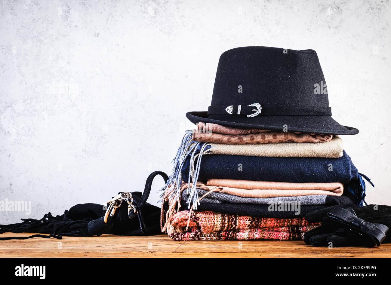 Autumn background with warm autumn and winter clothes, scarves ...