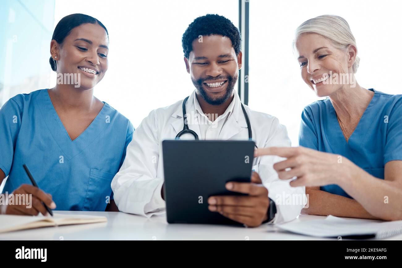 Doctor, team and tablet in meeting with smile for medical strategy, planning or schedule at the ...