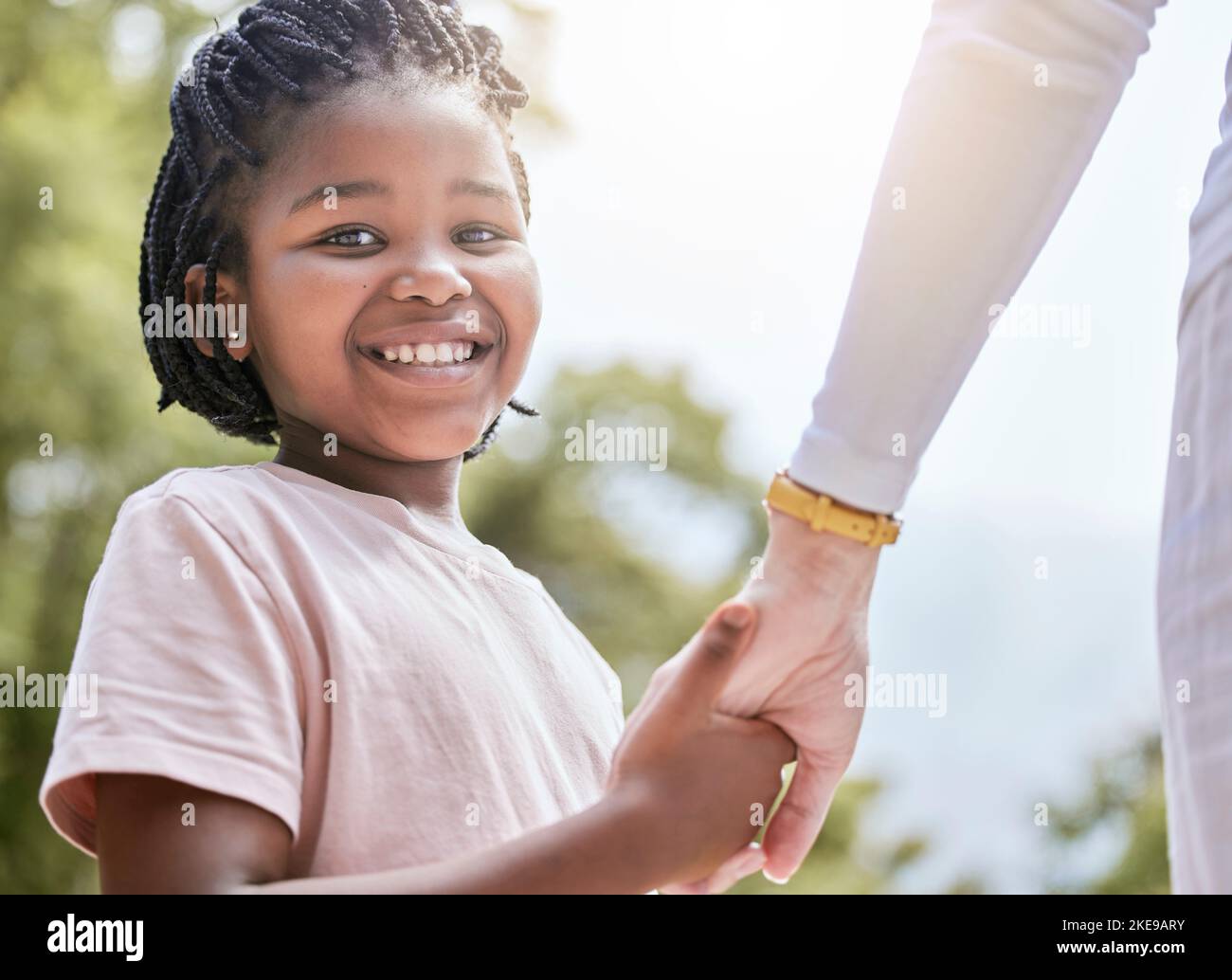 Portrait, adoption and family holding hands by mother and child ...