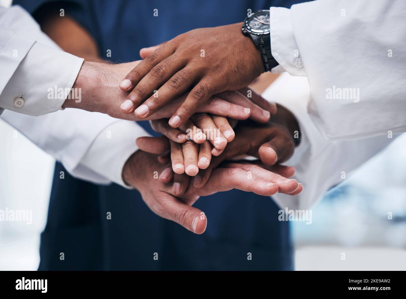 Hands, teamwork and unity with a business team of diversity standing in ...