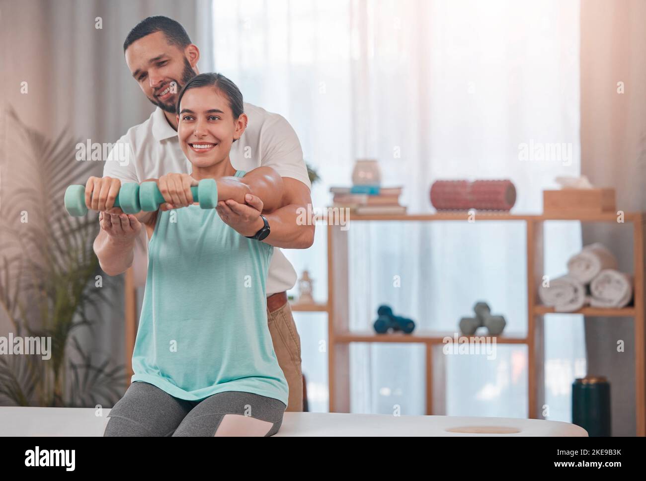 Physiotherapy, dumbbell and exercise by woman for recovery ...