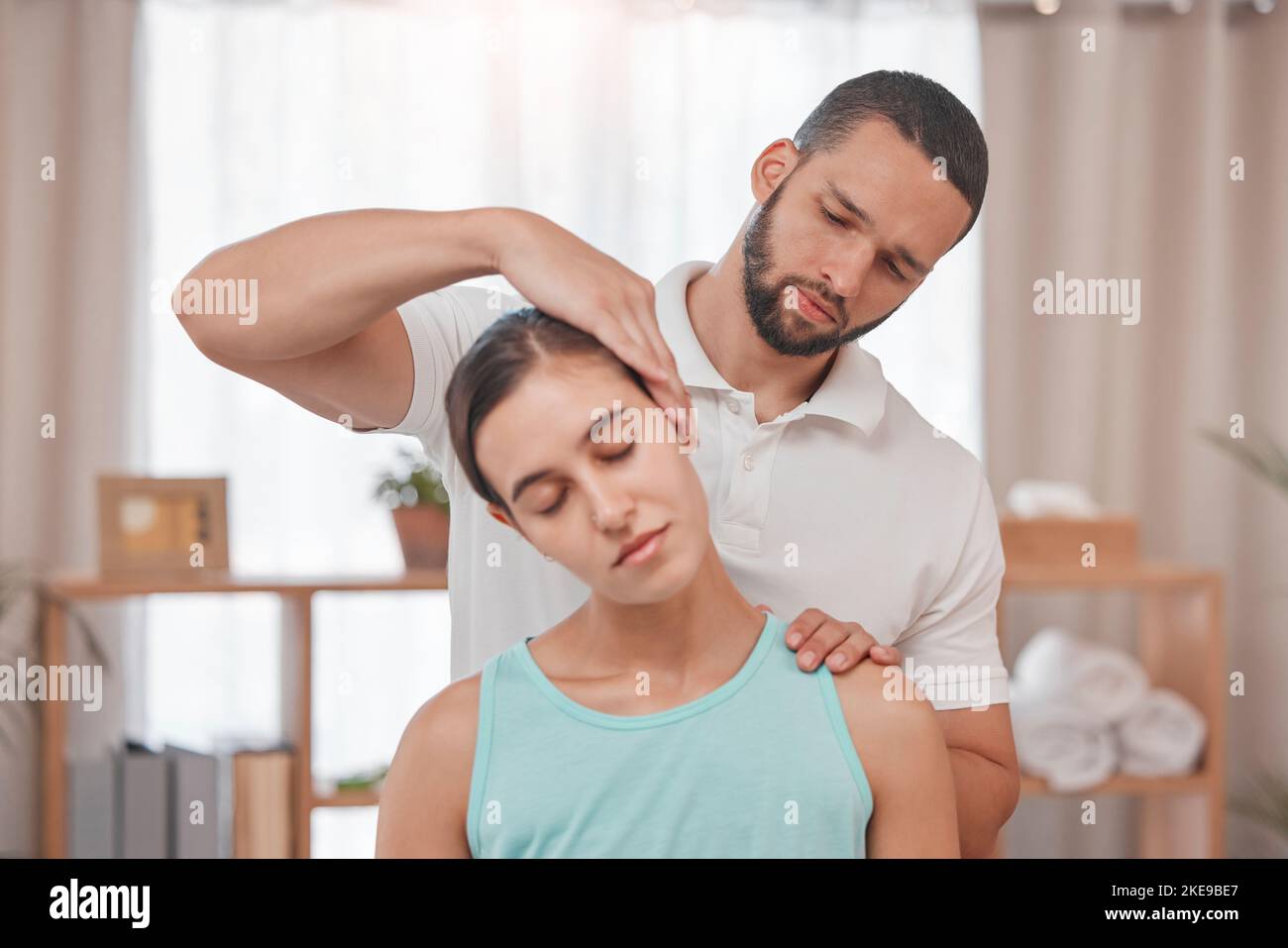 Physiotherapy, neck injury and woman in a consultation room with ...