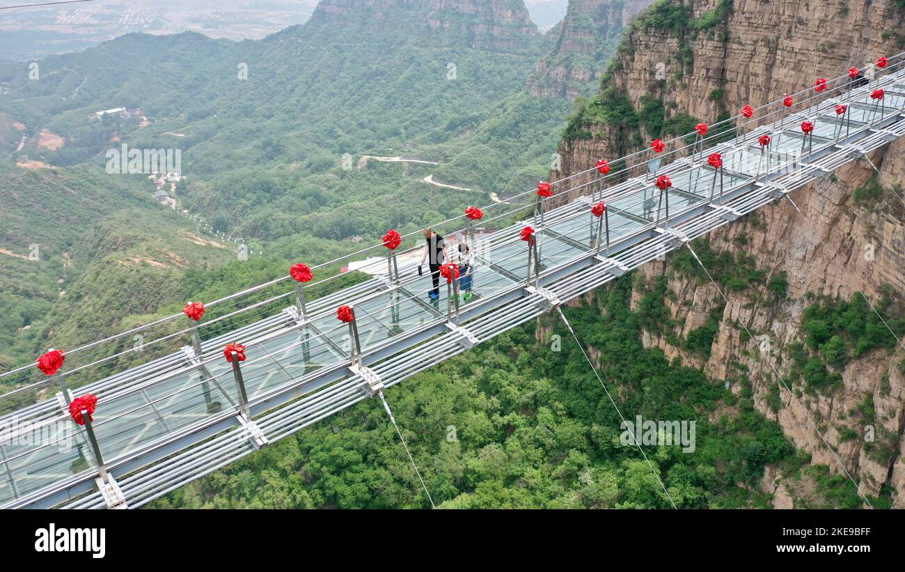 Aerial photos show the world's longest glass suspension bridge ...