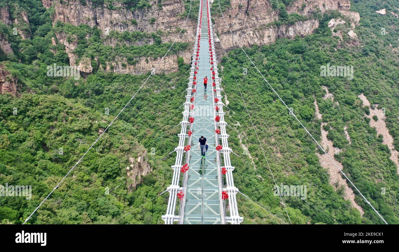 Aerial photos show the world's longest glass suspension bridge ...