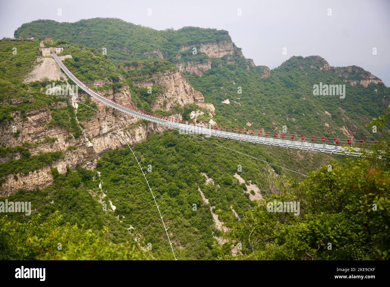 Aerial photos show the world's longest glass suspension bridge ...