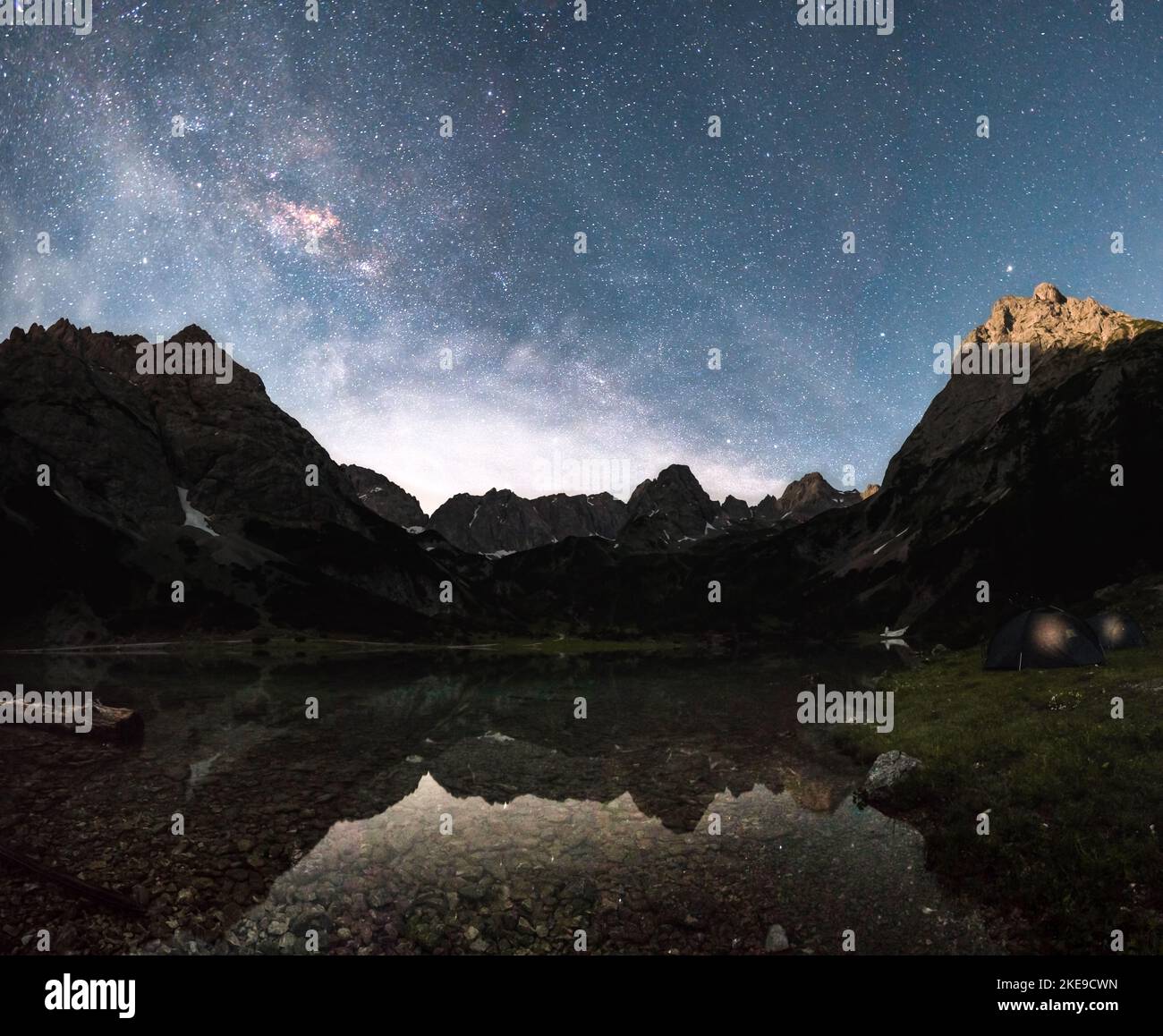 A beautiful scenery of a starry sky with shades of blue reflected in ...