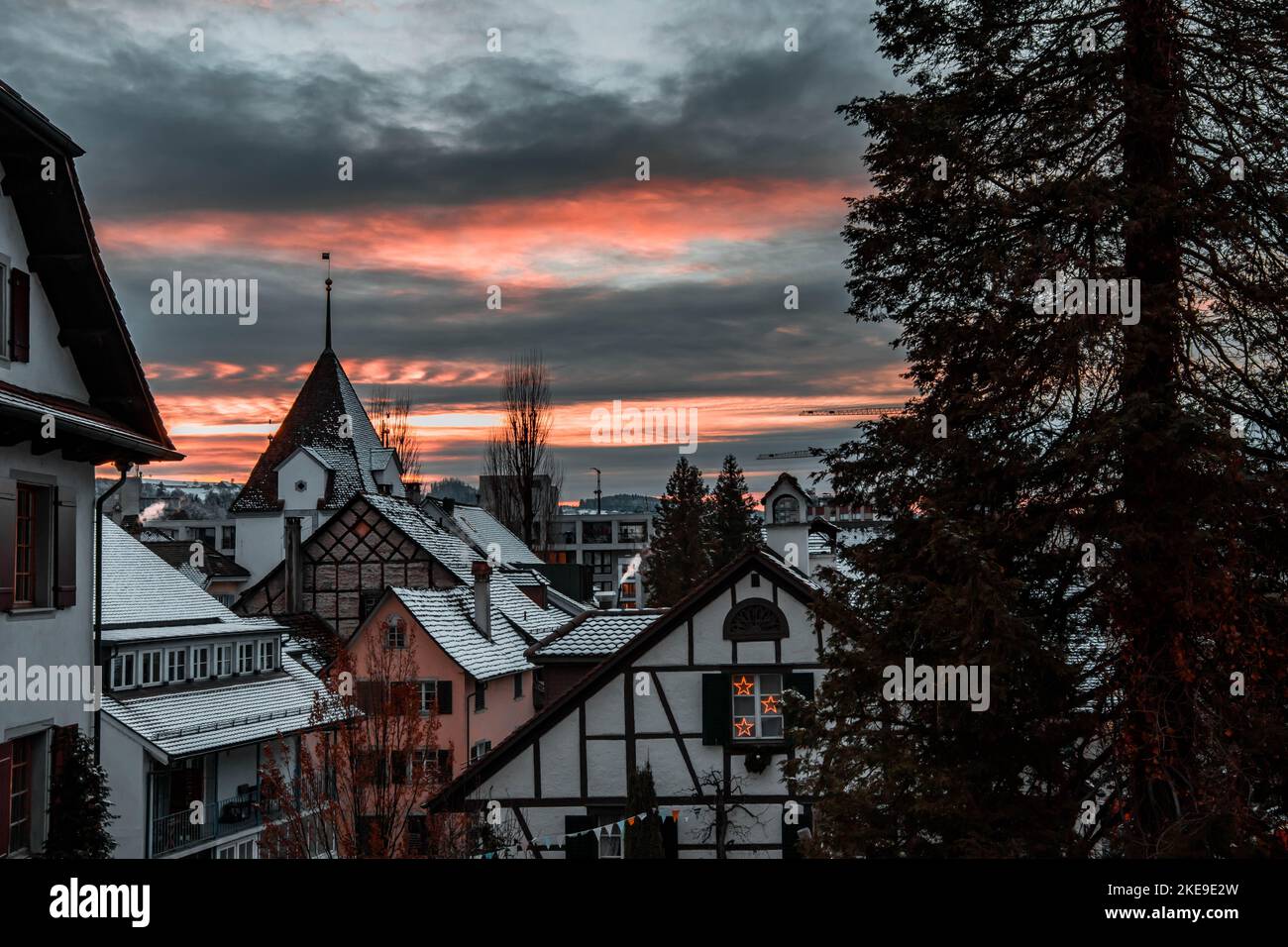 An aerial view of town surrounded by buildings in Germany during sunset ...