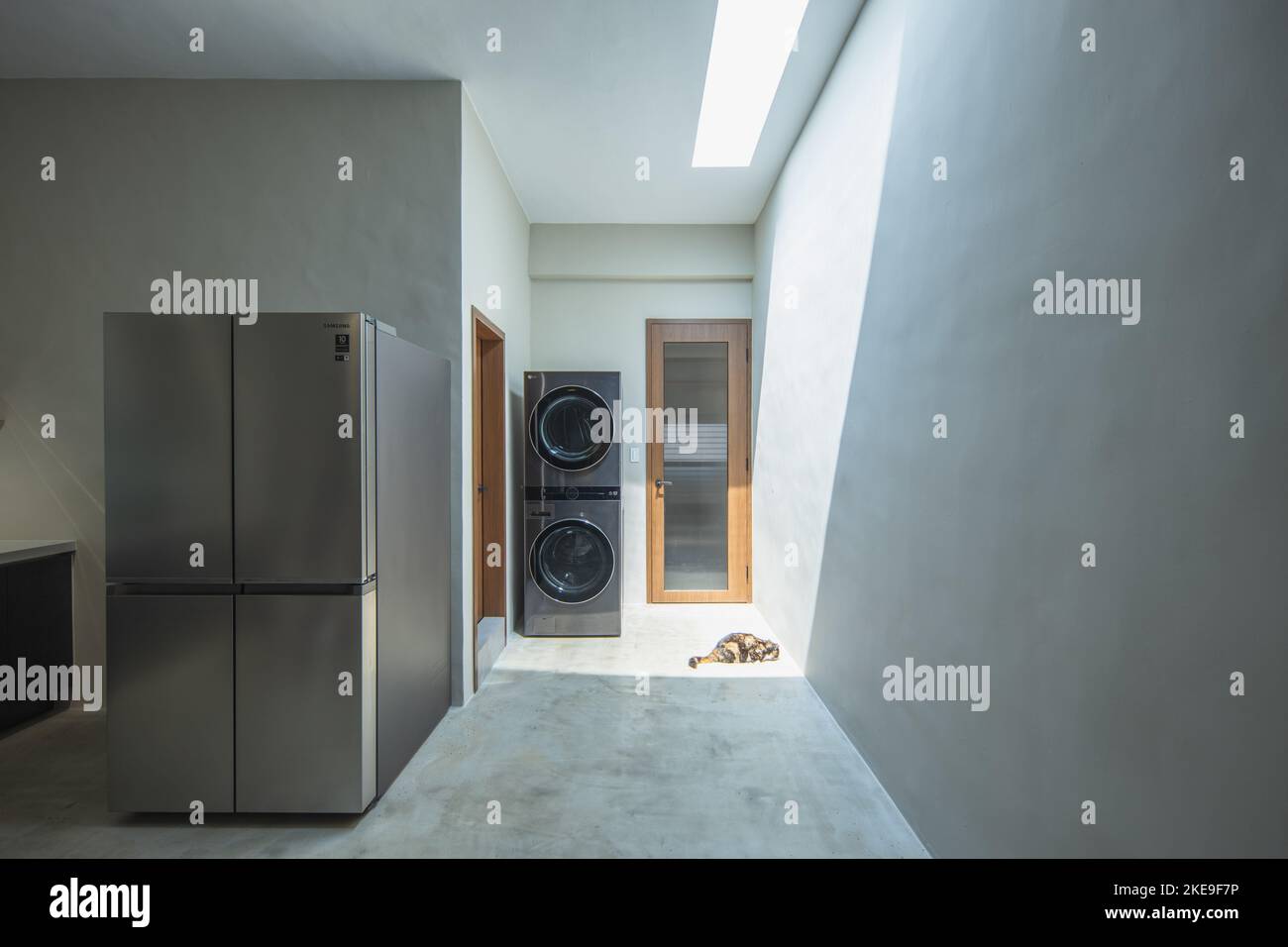 An Interior Design of a modern kitchen with washing machines and ...