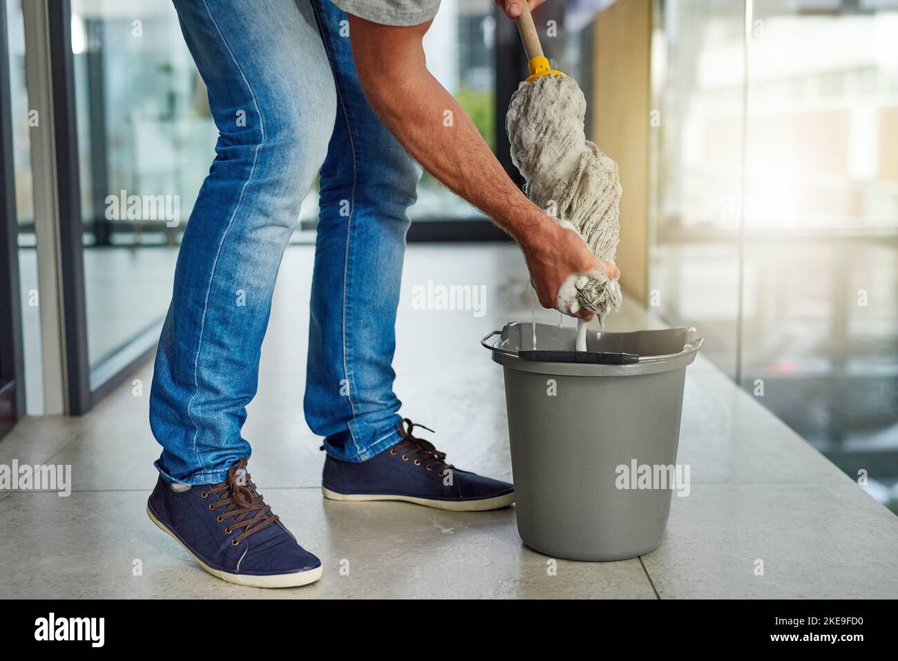 Using the perfect amount of water. an unrecognizable man ringing out a ...