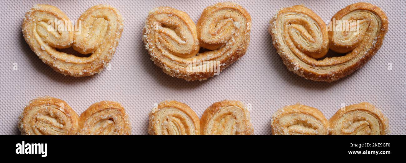 Delicious appetizing cookies with sugar puff pastry top view background ...