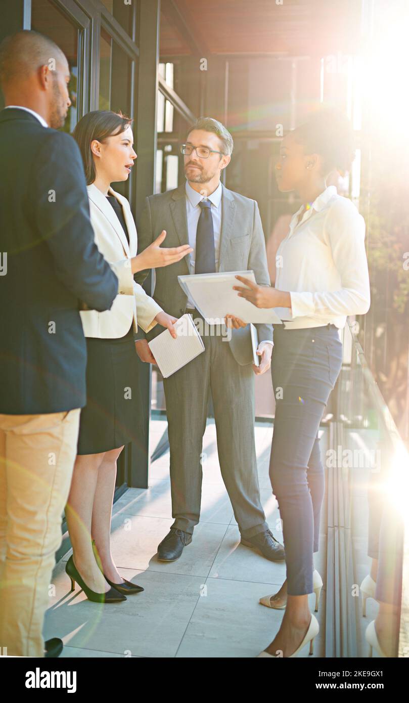 Time for some innovative thinking. a diverse group of businesspeople ...