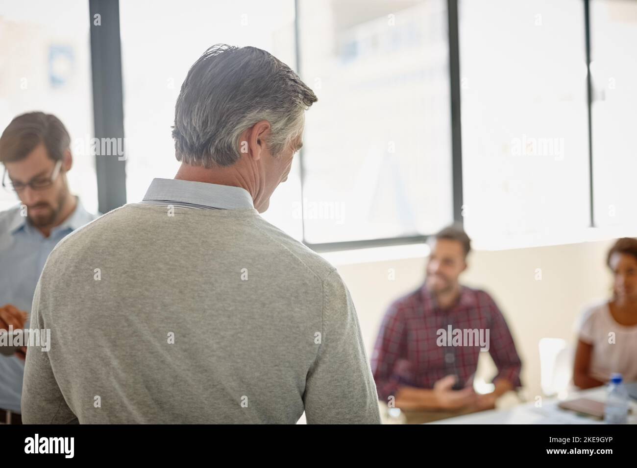 Creative team having progress meeting hi-res stock photography and ...