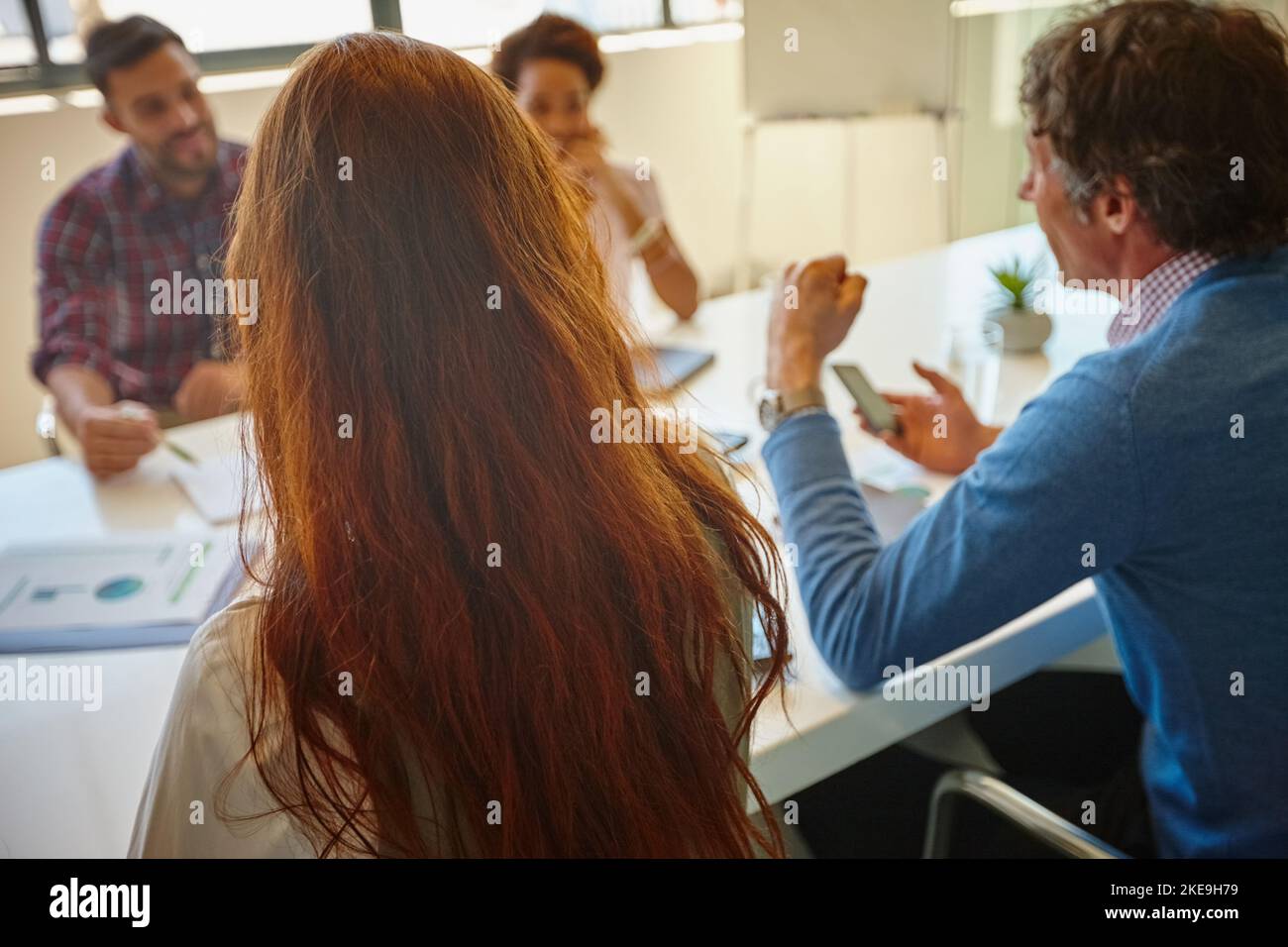Regrouping as a team. a group of colleagues having a meeting at work ...